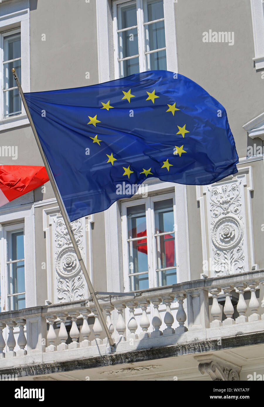 European Union flag hanging on vintage building on wind Stock Photo - Alamy