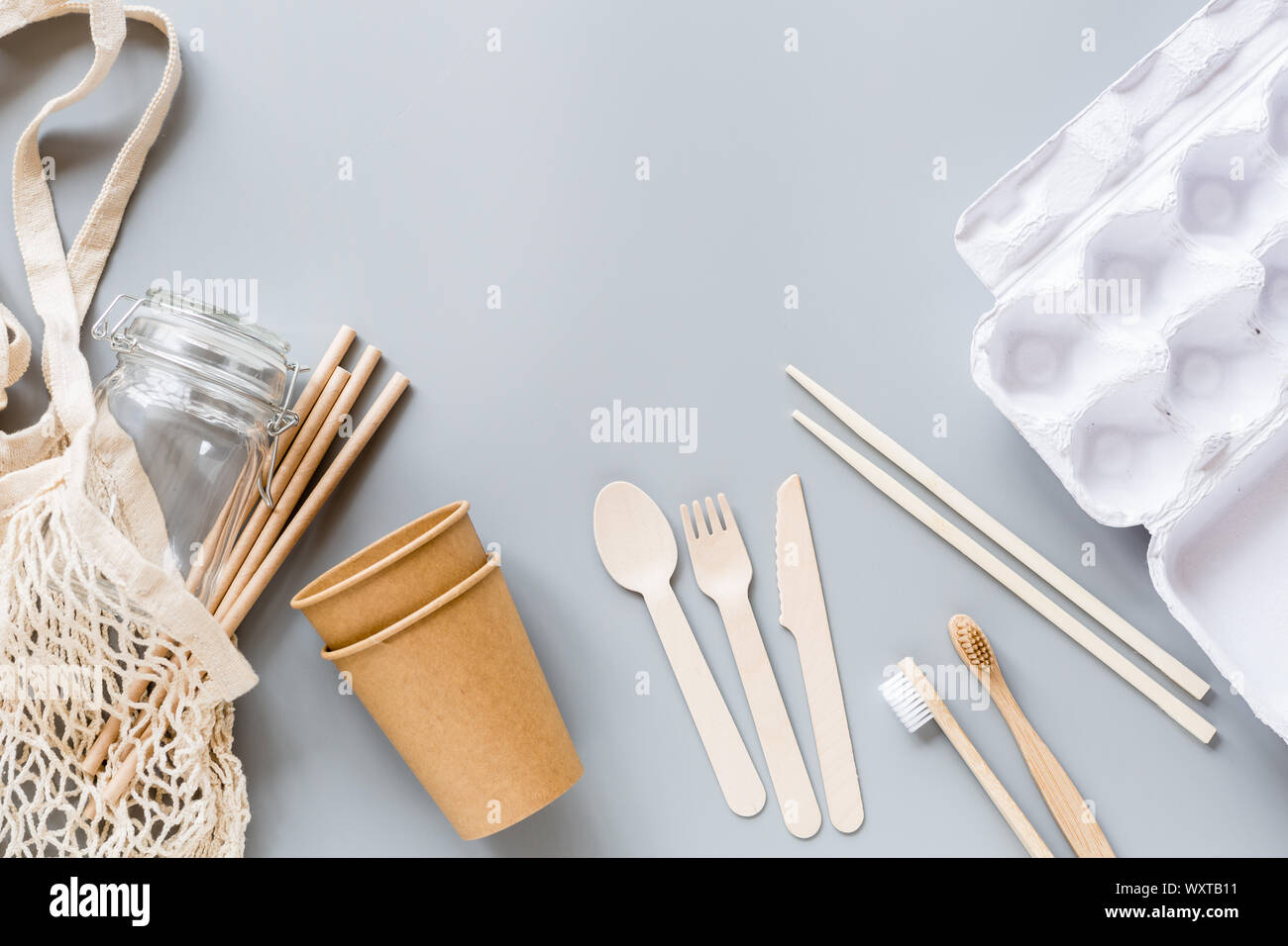 eco natural paper cups, straws, bag flat lay on gray background ...