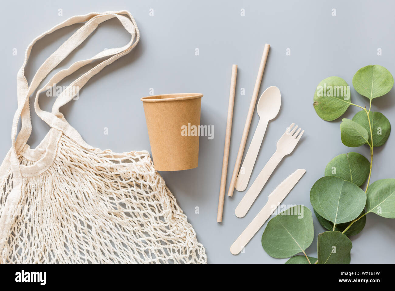 eco natural paper cups, straws, bag flat lay on gray background ...