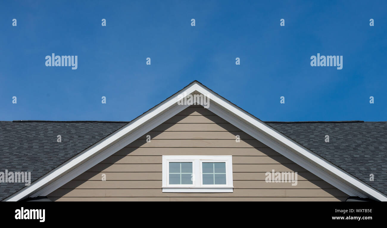 White attic window vent, gable, corbel, louver on a new construction ...