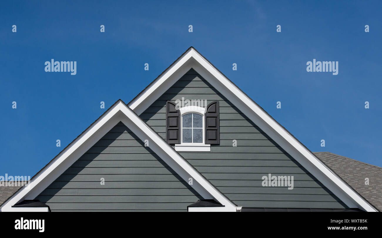 Plastic or wood white roof decoration gable, corbel, louver on a new ...