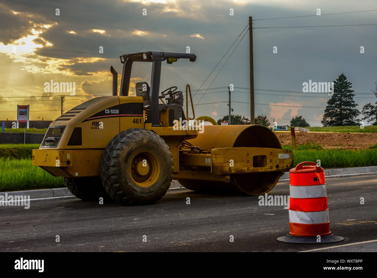 Yellow excavation bulldozer equipment road roller stream roller at a ...