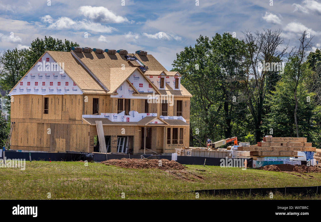 Typical American single family house frame under construction with ...