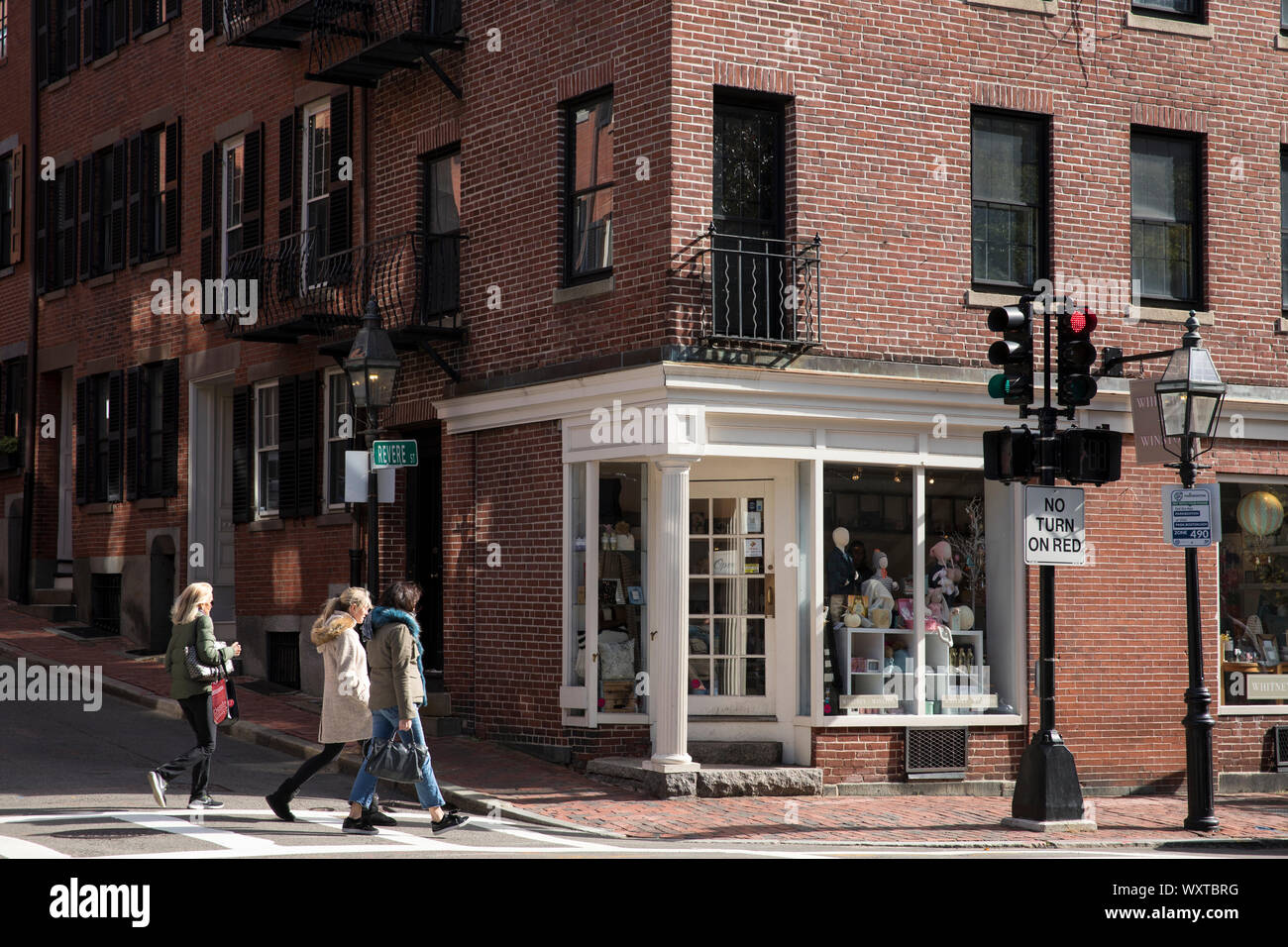 Street scene of people walking, shops, traffic and traffic lights - in ...