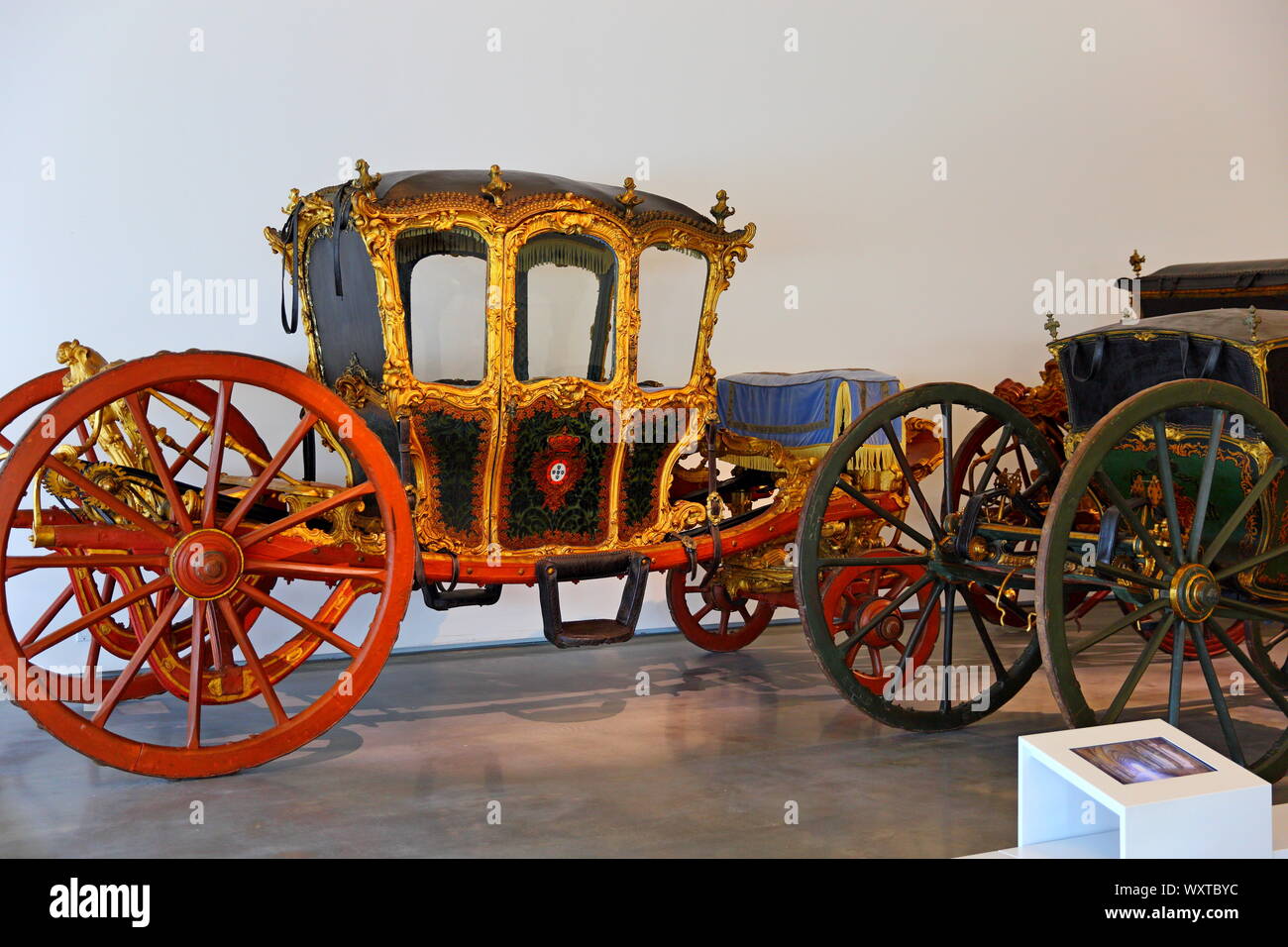 Exhibits of antique carriages in National Coach Museum in Lisbon ...