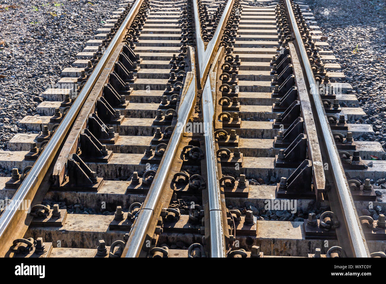 Close up of redirection train or railroad tracks with cement backing In ...