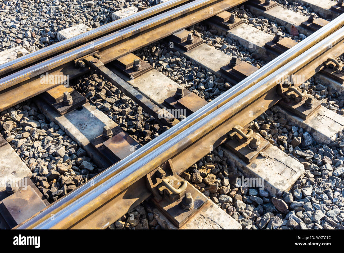 Close up of train or railroad tracks with cement backing In the ...