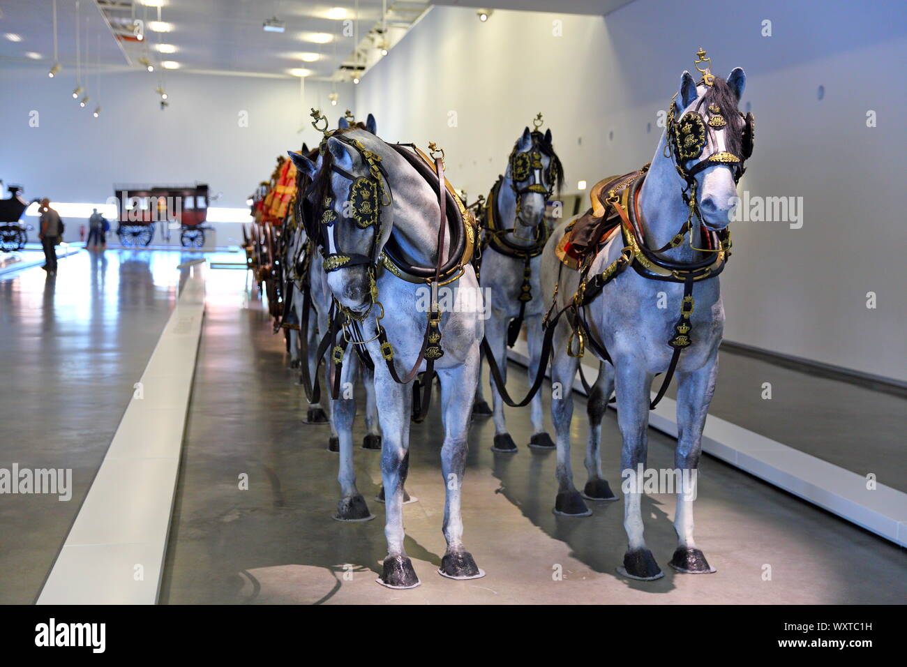 Exhibits of antique carriages in National Coach Museum in Lisbon ...