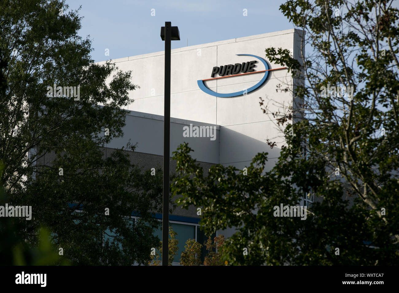 A logo sign outside of a facility occupied by Purdue Pharma L.P., in ...