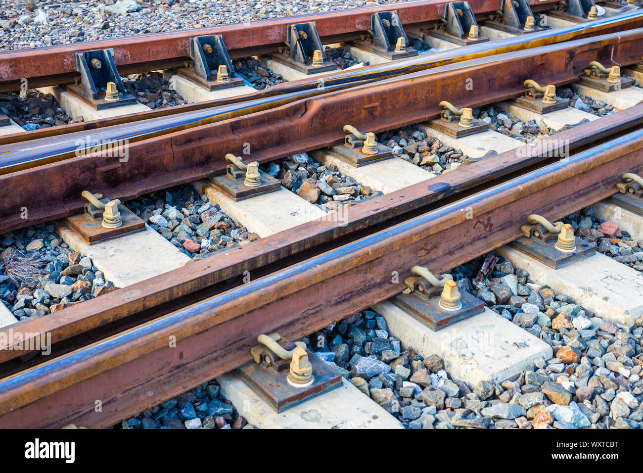 Close up of train or railroad tracks with cement backing In the ...