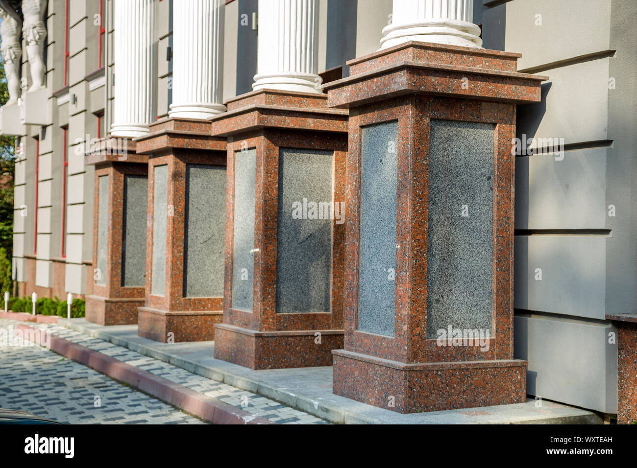 Detail of a house facade. Granite columns as decorative elements of the ...