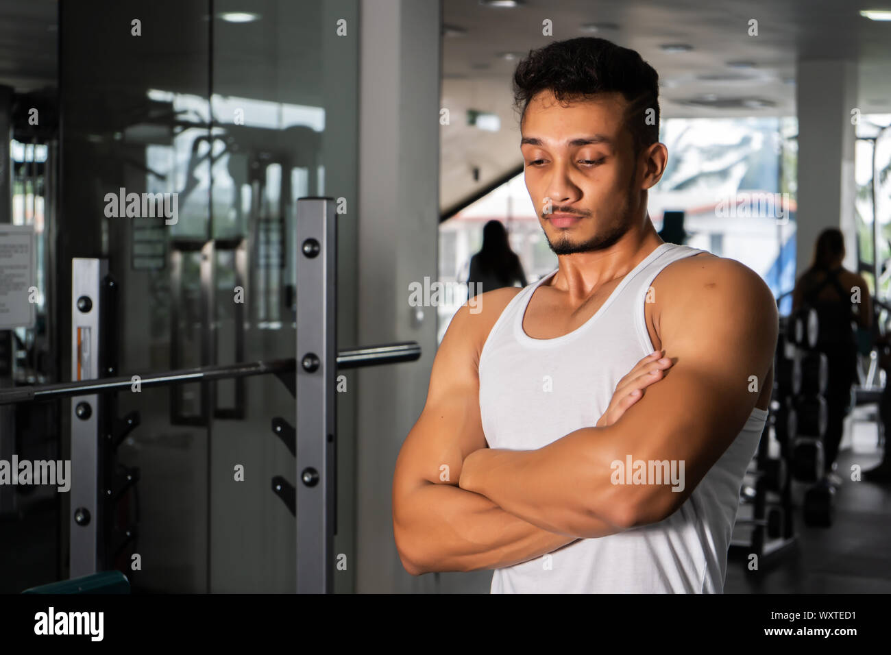 Fit man standing and relax after the training session in gym,Concept ...