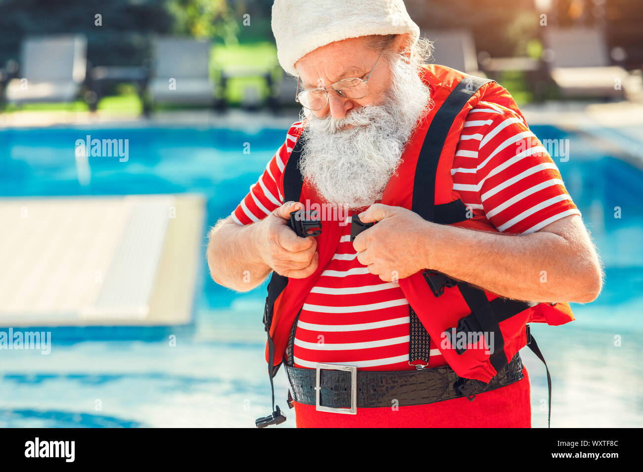 Santa Claus near the pool holiday vacation concept Stock Photo - Alamy