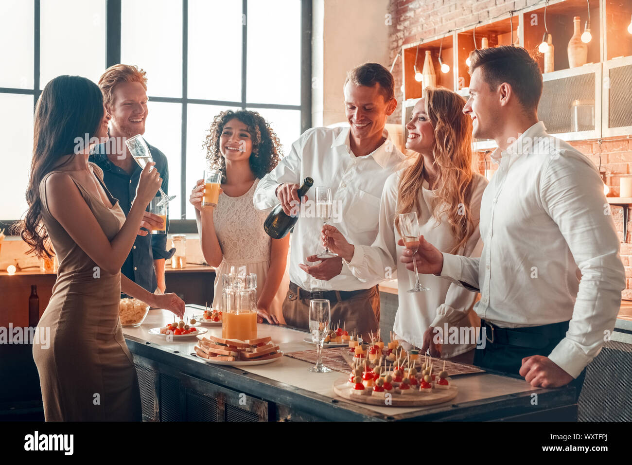 Group of friends party together indoors celebration Stock Photo - Alamy
