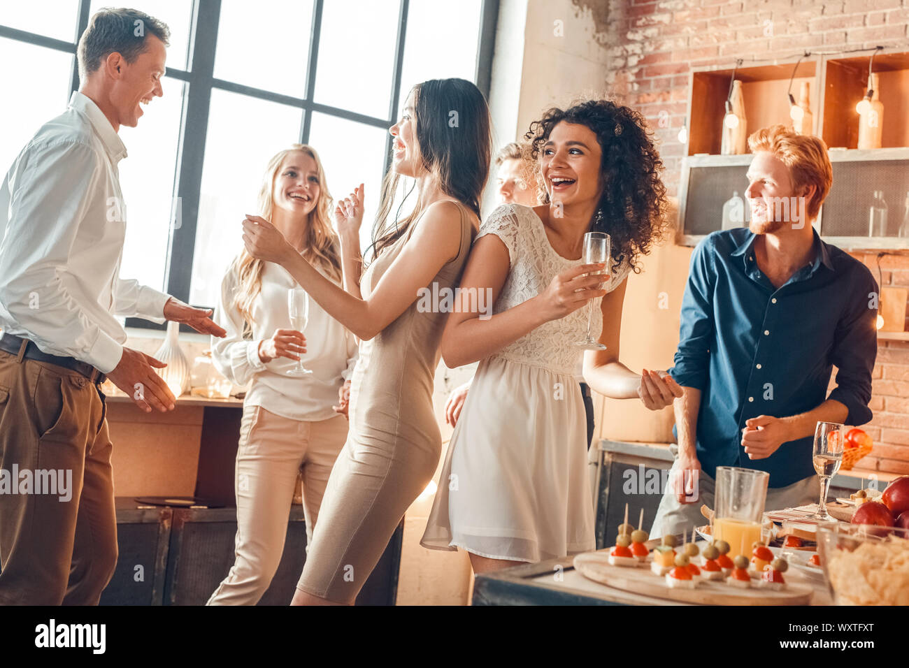 Group of friends party together indoors celebration Stock Photo - Alamy