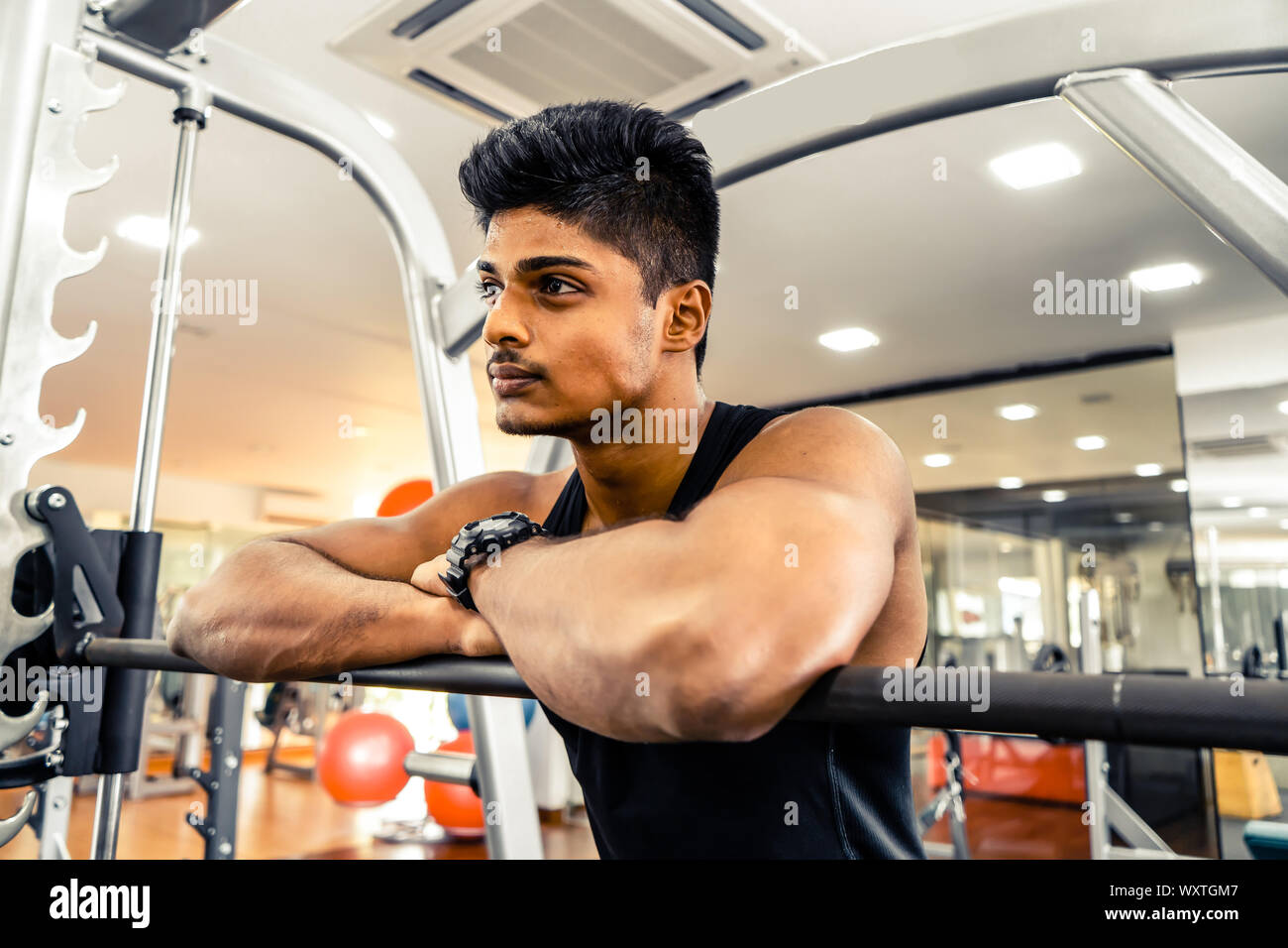 Fit man standing and relax after the training session in gym,Concept ...