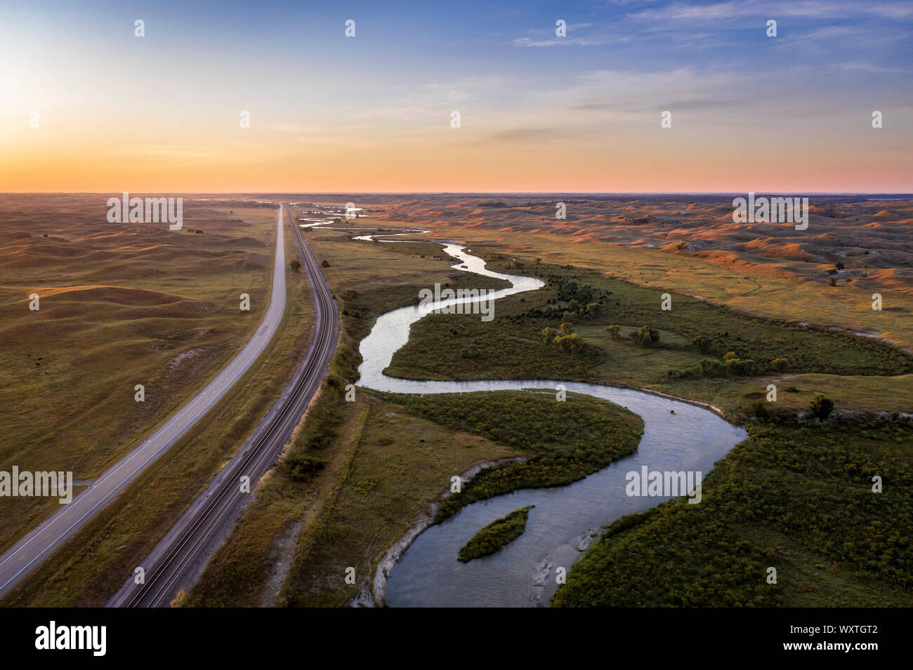 dawn over a river meandering through Nebraska Sandhills - aerial view ...