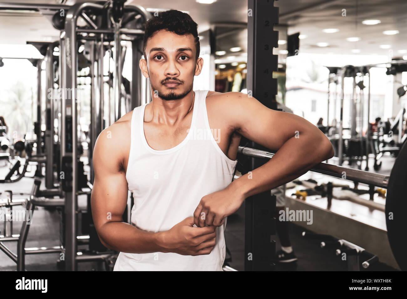 Fit man standing and relax after the training session in gym,Concept ...