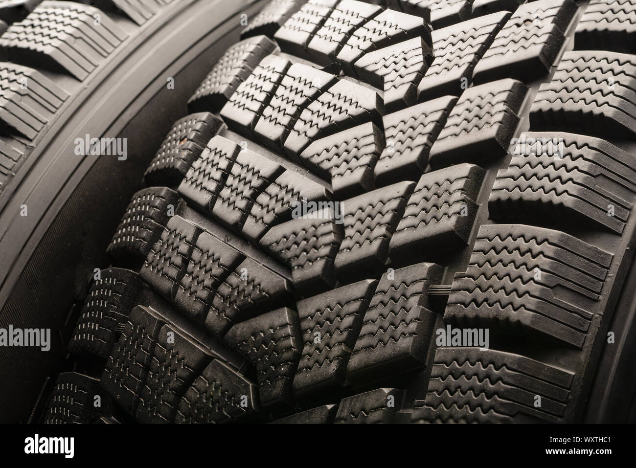 winter tires Velcro without spikes friction, used, close-up on a black ...