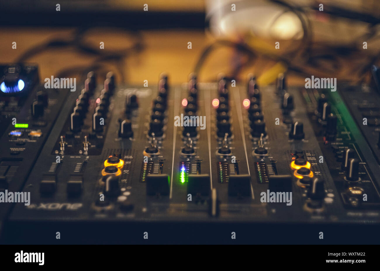 DJ CD player and mixer. DJ Spinning, Mixing, and Scratching in a Night ...