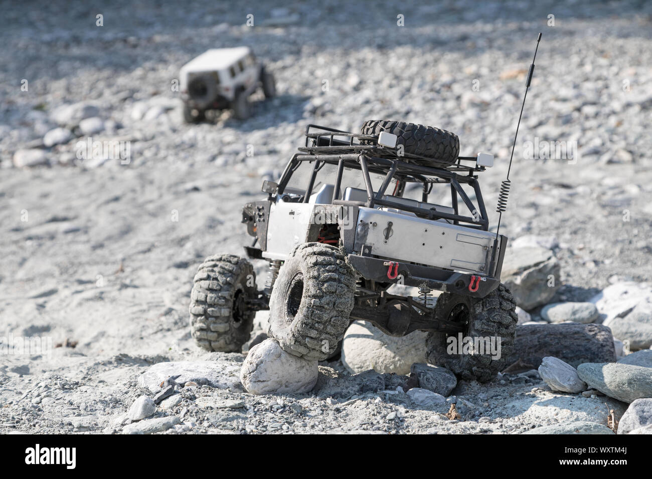 remote controlled jeep driving over stones Stock Photo - Alamy