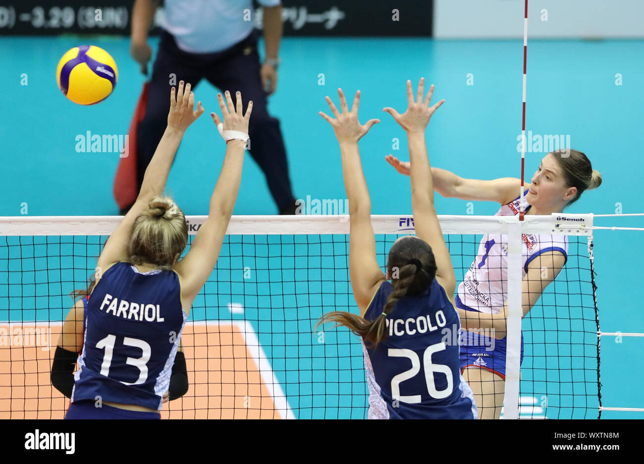 Hamamatsu, Japan. 18th Sep, 2019. Bianka Busa (R) of Serbia spikes the ...