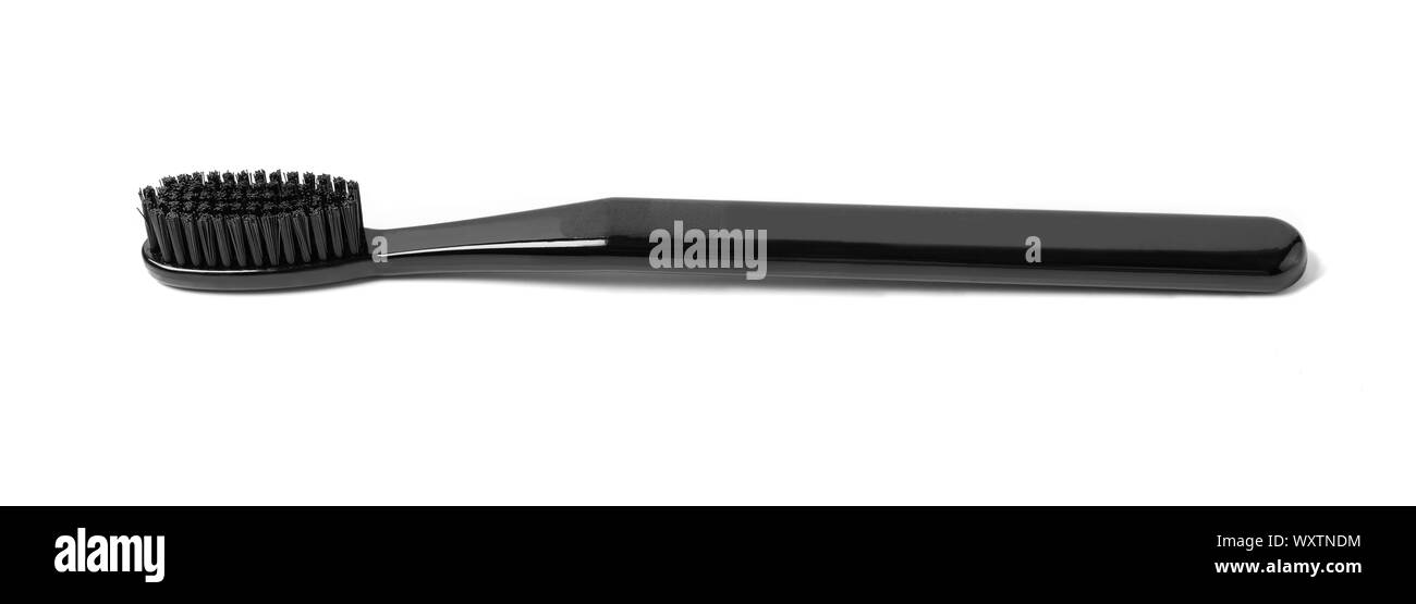 Classic black toothbrush isolated on white background Stock Photo - Alamy