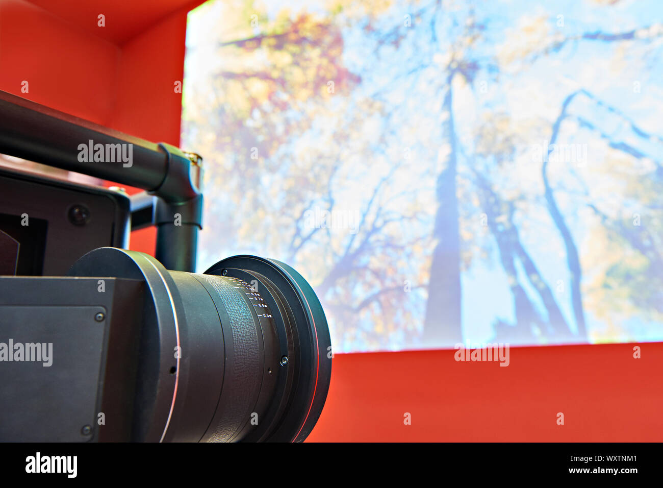 Professional projector lens and screen cinema Stock Photo - Alamy