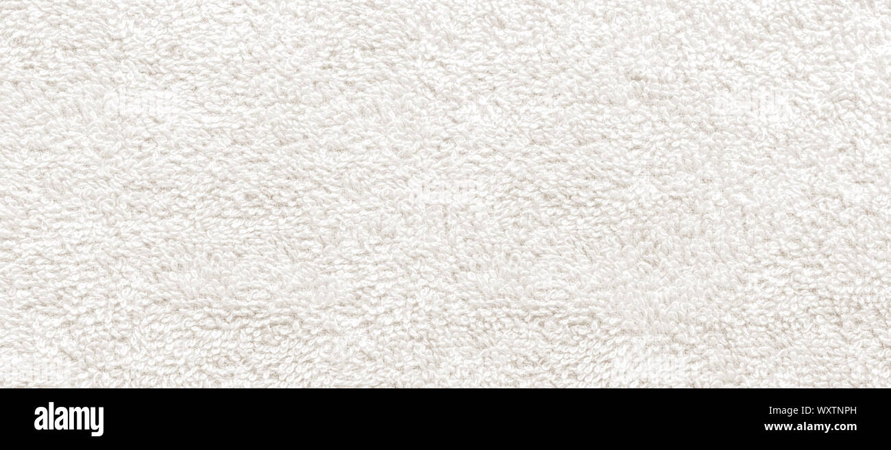 white fabric and texture concept - close up of a towel terry cloth ...