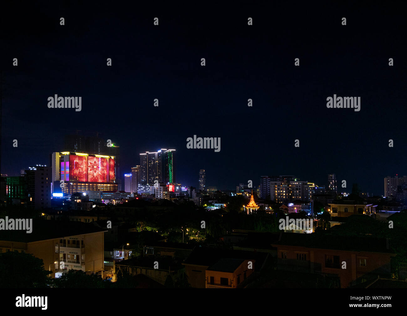 downtown central phnom penh city night view in cambodia with Naga World ...