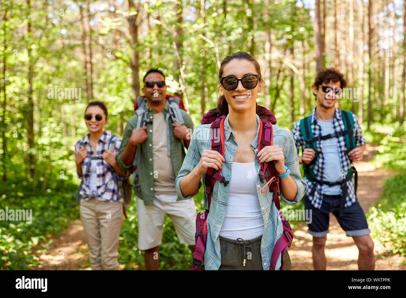 travel, tourism, hike and people concept - group of friends with ...