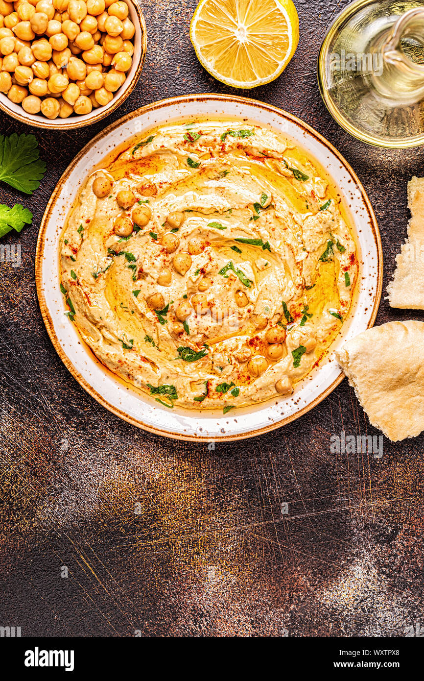Homemade hummus, chickpea dip, with spices. Top view Stock Photo - Alamy