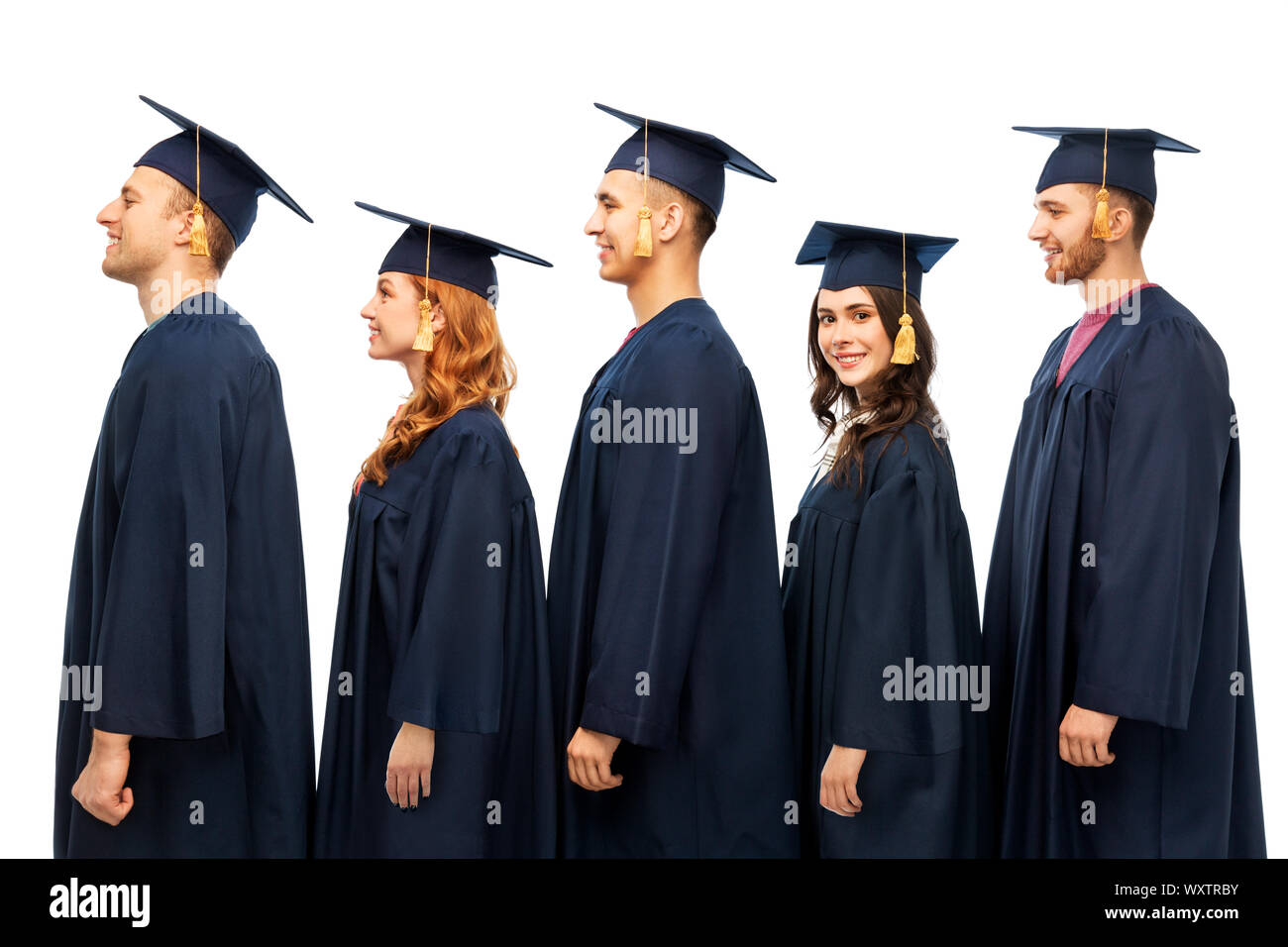 education, graduation and people concept - group of happy graduate ...