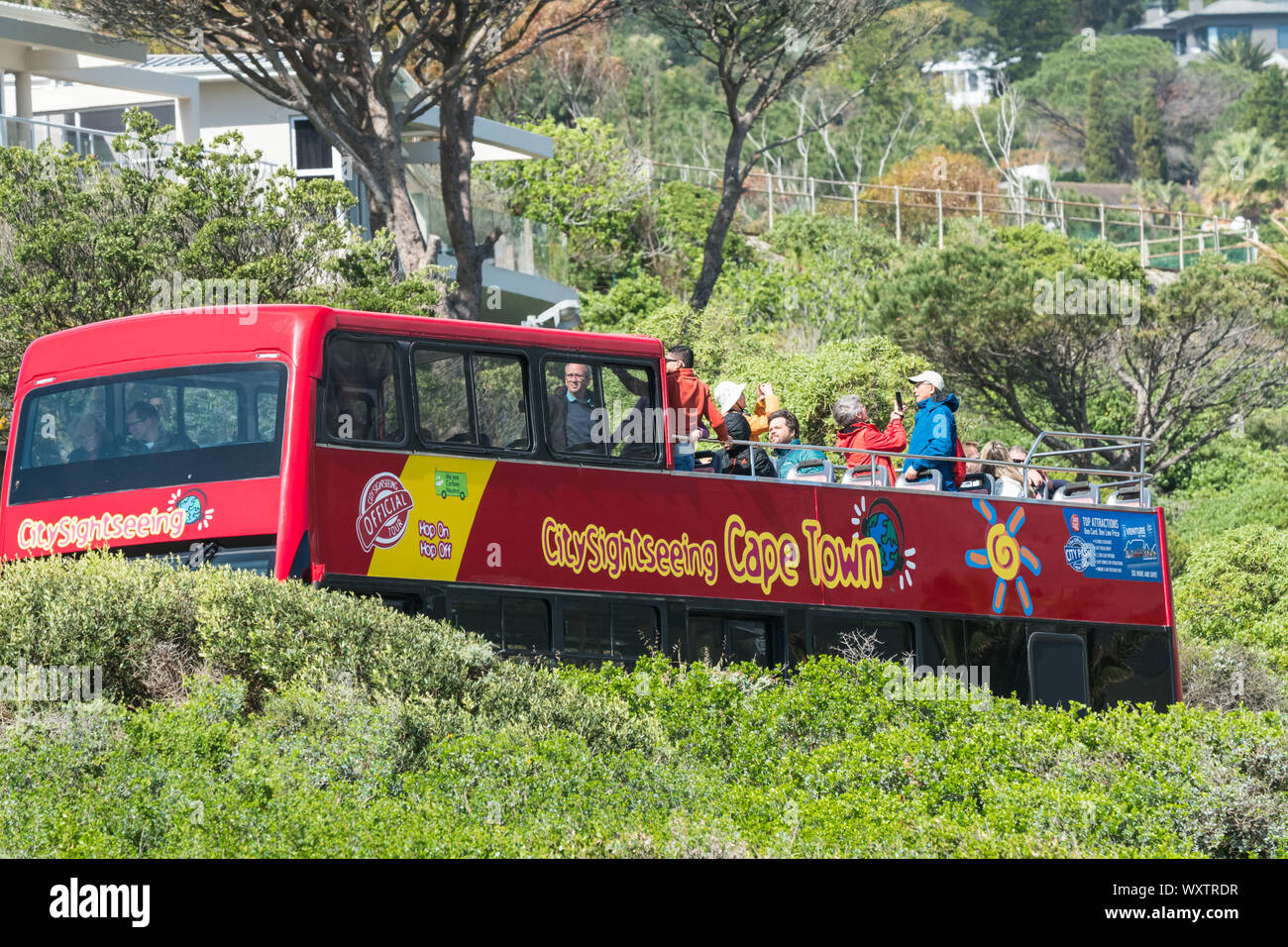 tourists and people on Cape Town city sightseeing red bus on top deck ...