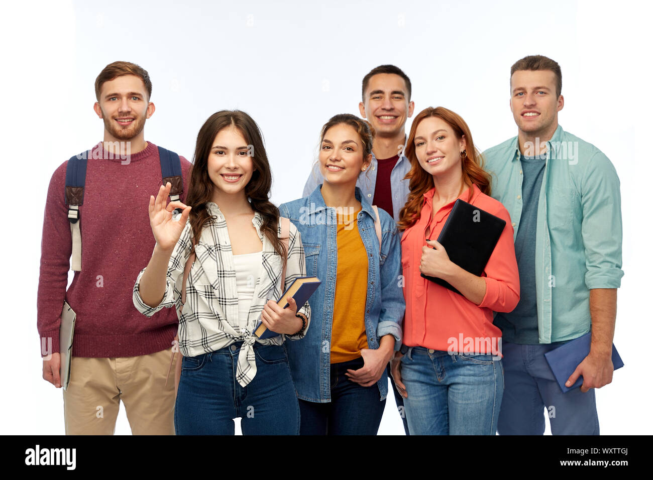 education, high school and people concept - group of smiling students ...