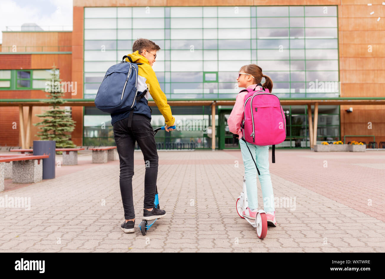 education, childhood and people concept - happy school children with ...