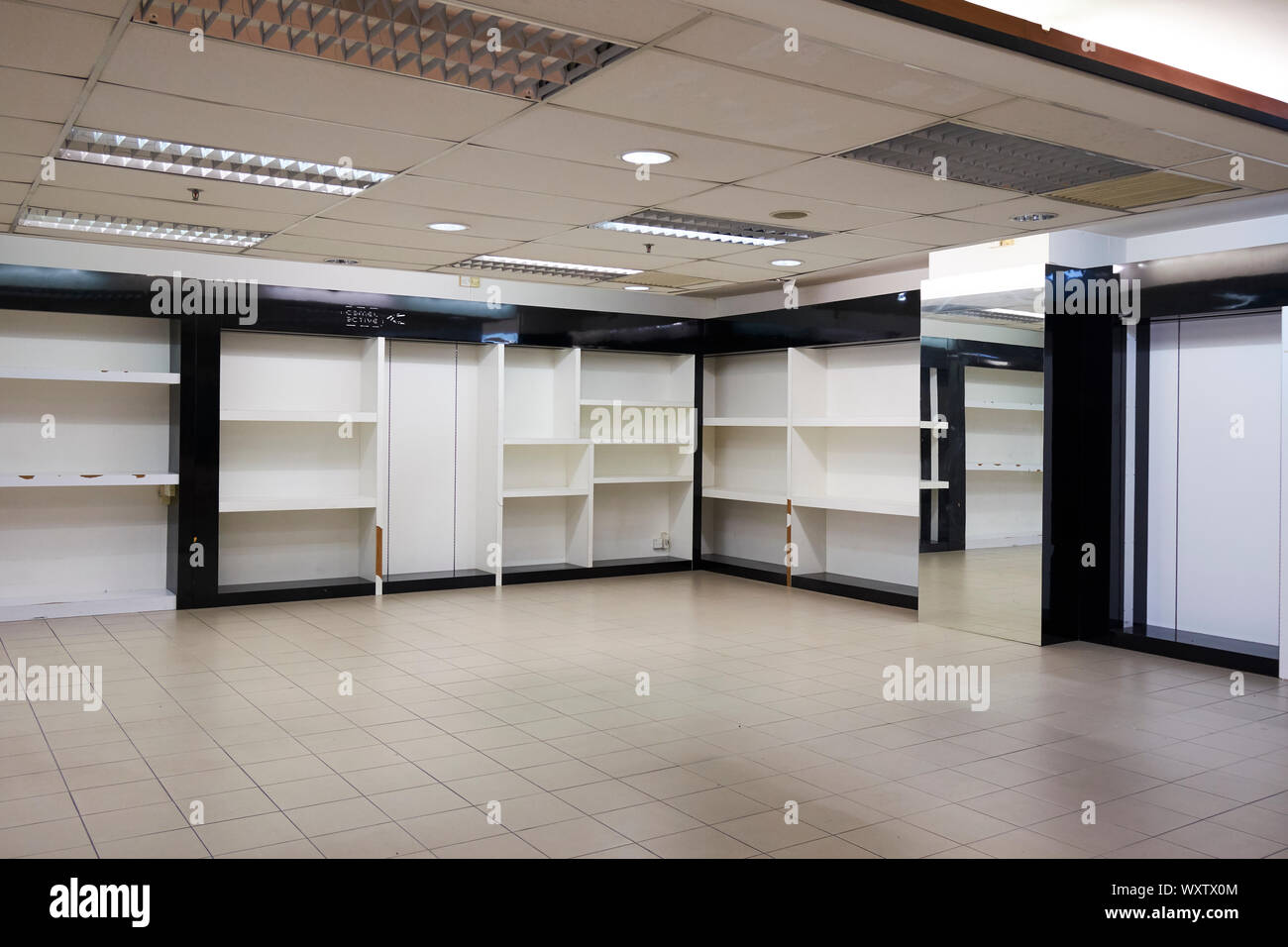 A closed, empty and abandoned store in a shopping mall in Kuching ...