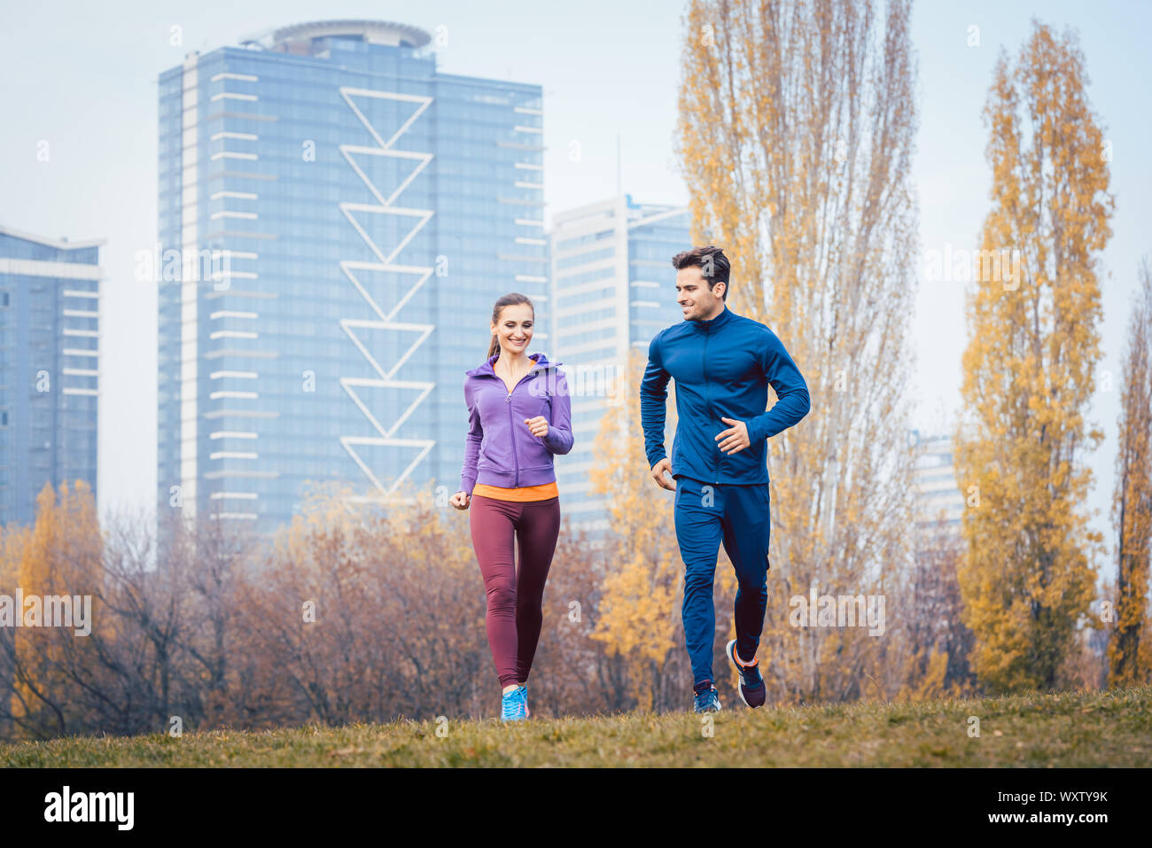 Couple jogging together on beautiful hi-res stock photography and ...