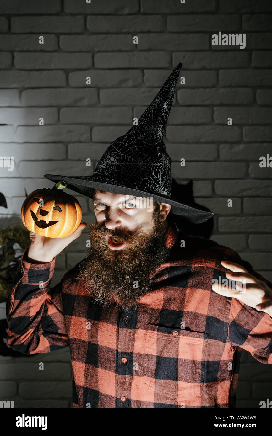 Halloween man with pumpkin in darkness. Holiday celebration symbols on ...