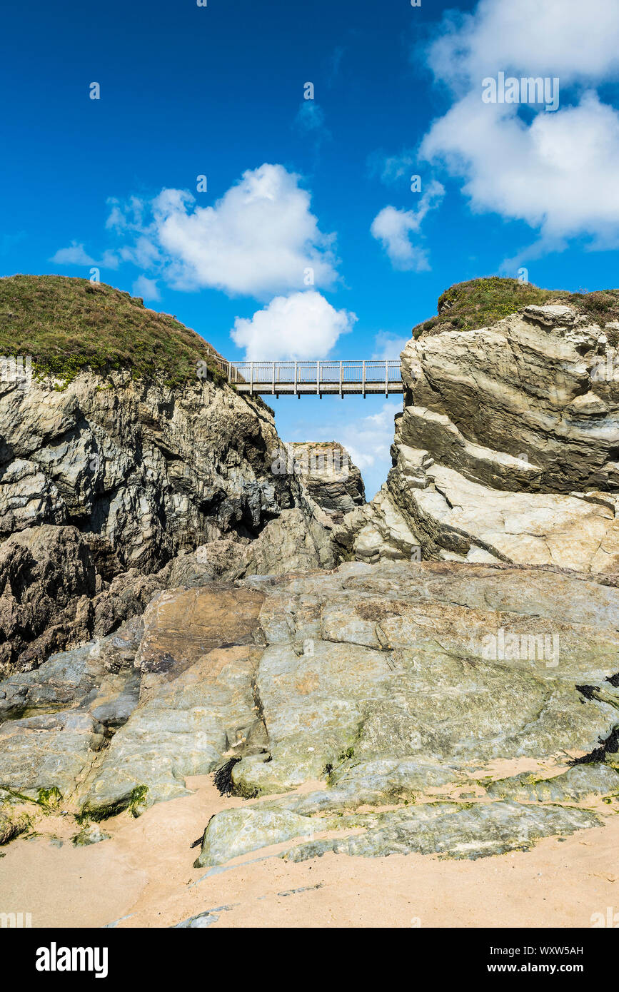 The footbridge connecting the mainland to Porth Island at Porth Beach ...