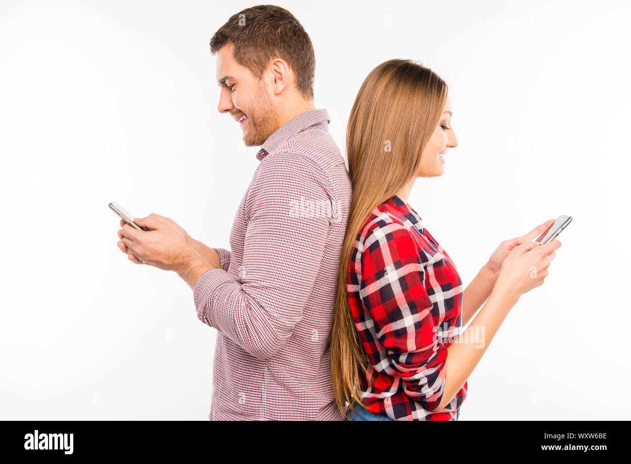 Couple in love ignoring each other Stock Photo - Alamy