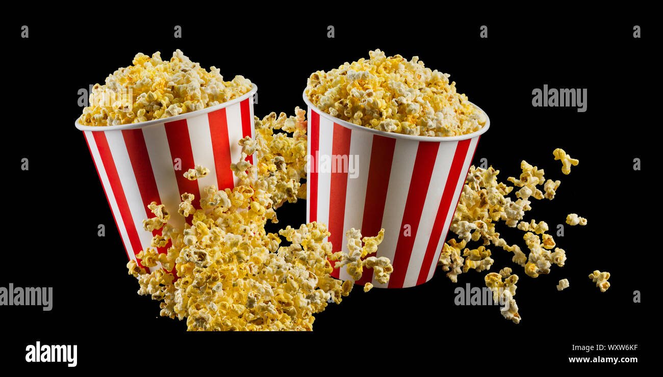 Set of paper striped buckets with popcorn isolated on black background ...