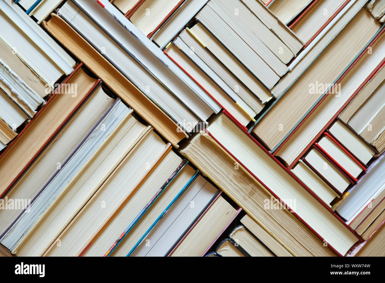 Books stack texture and background Stock Photo - Alamy