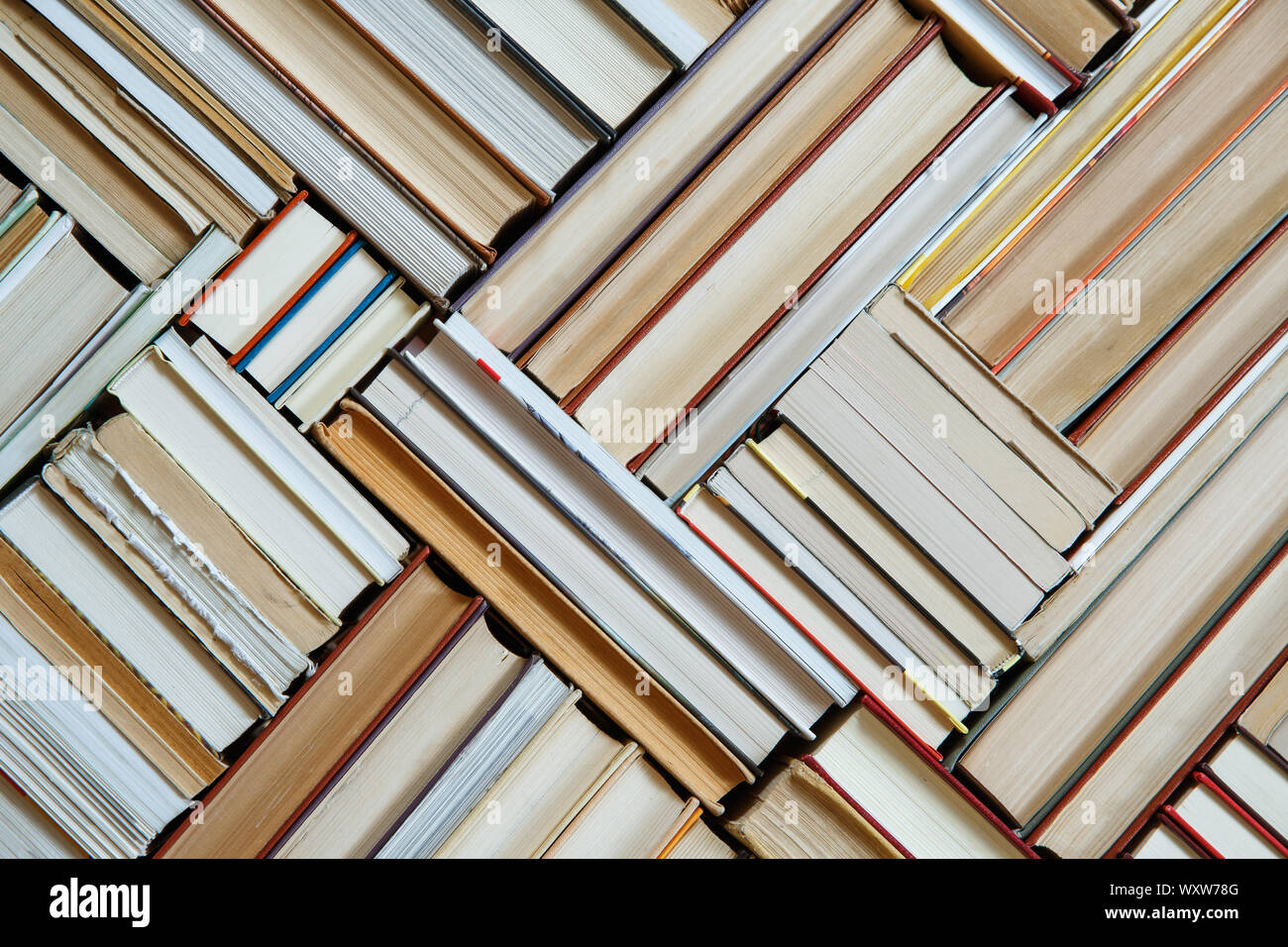 Books stack texture and background Stock Photo - Alamy
