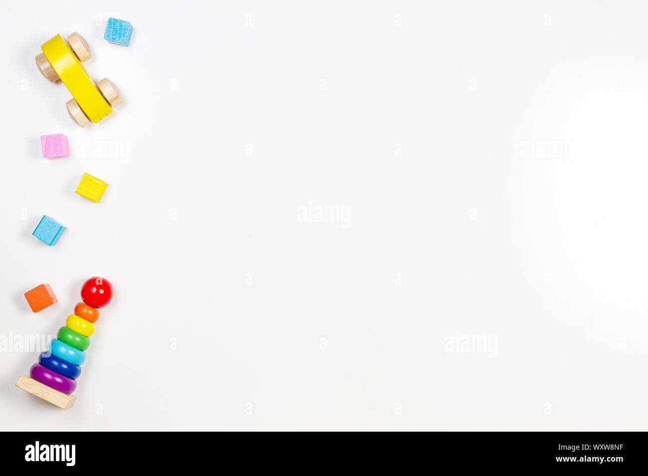 Baby kid toys background. Wooden toy car, baby stacking rings pyramid ...