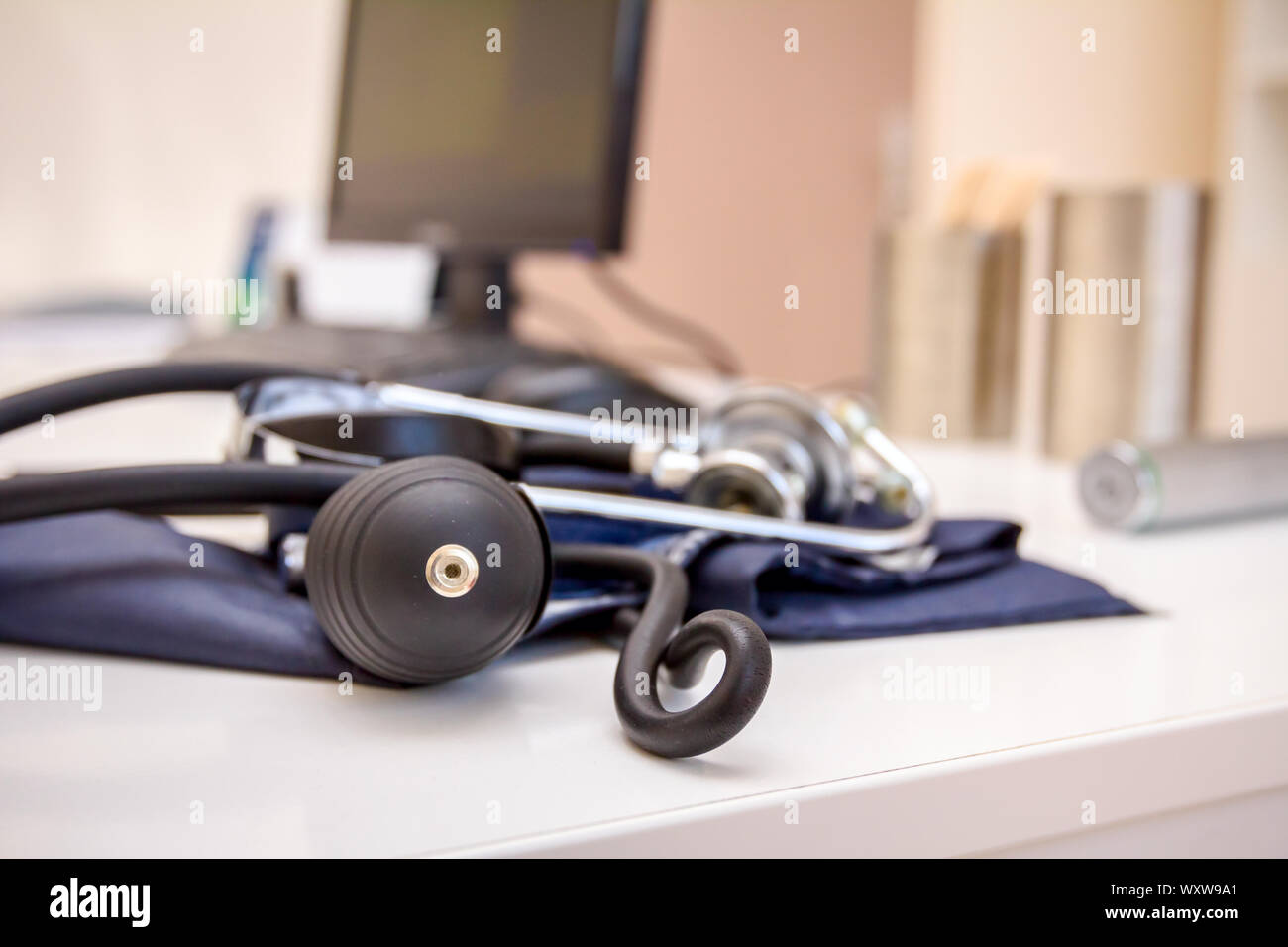 Doctor's table with medical equipment for examining the blood pressure ...