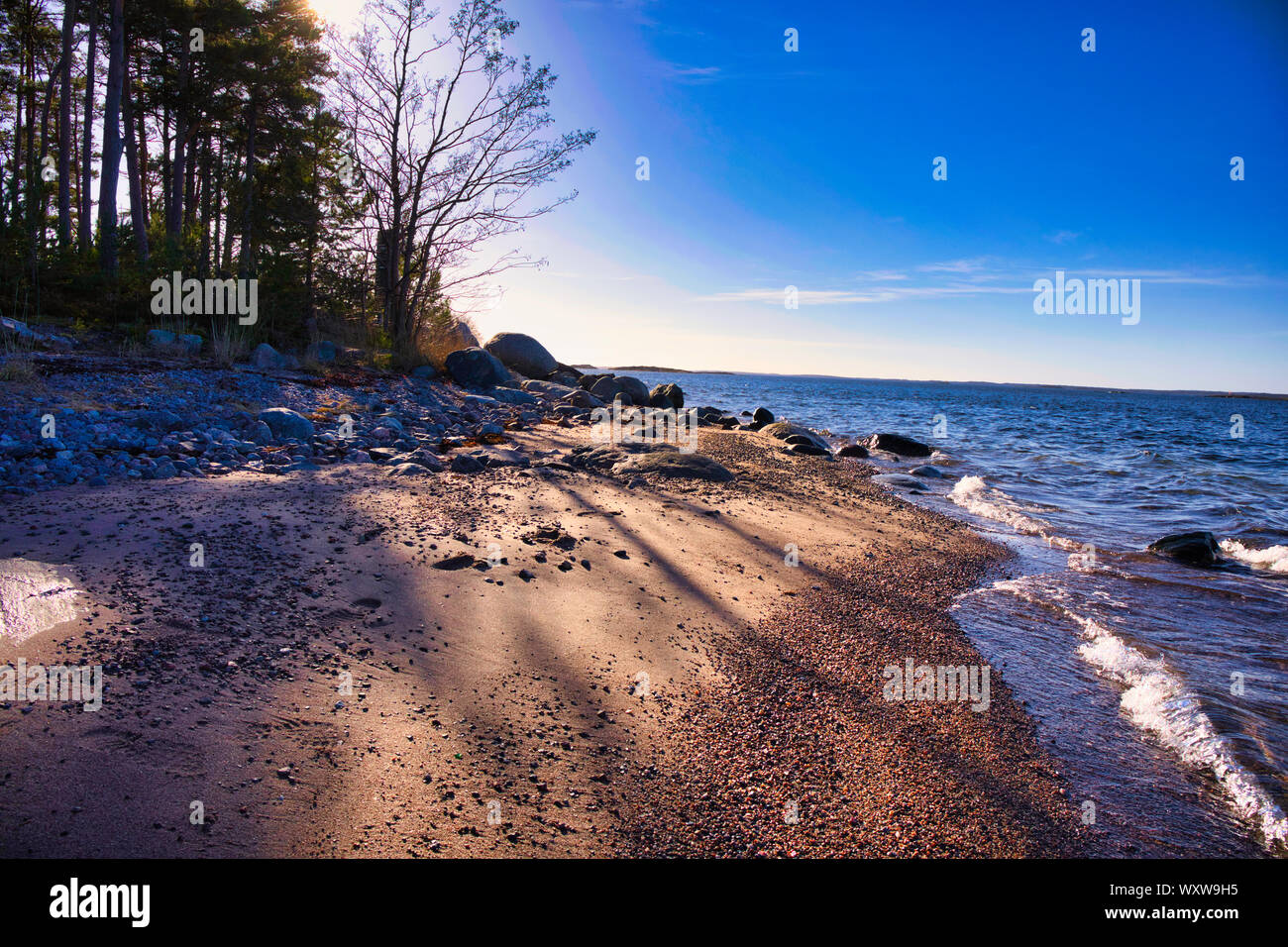 Sunlight and shadow in winter on beach on island of Sandhamn in the ...