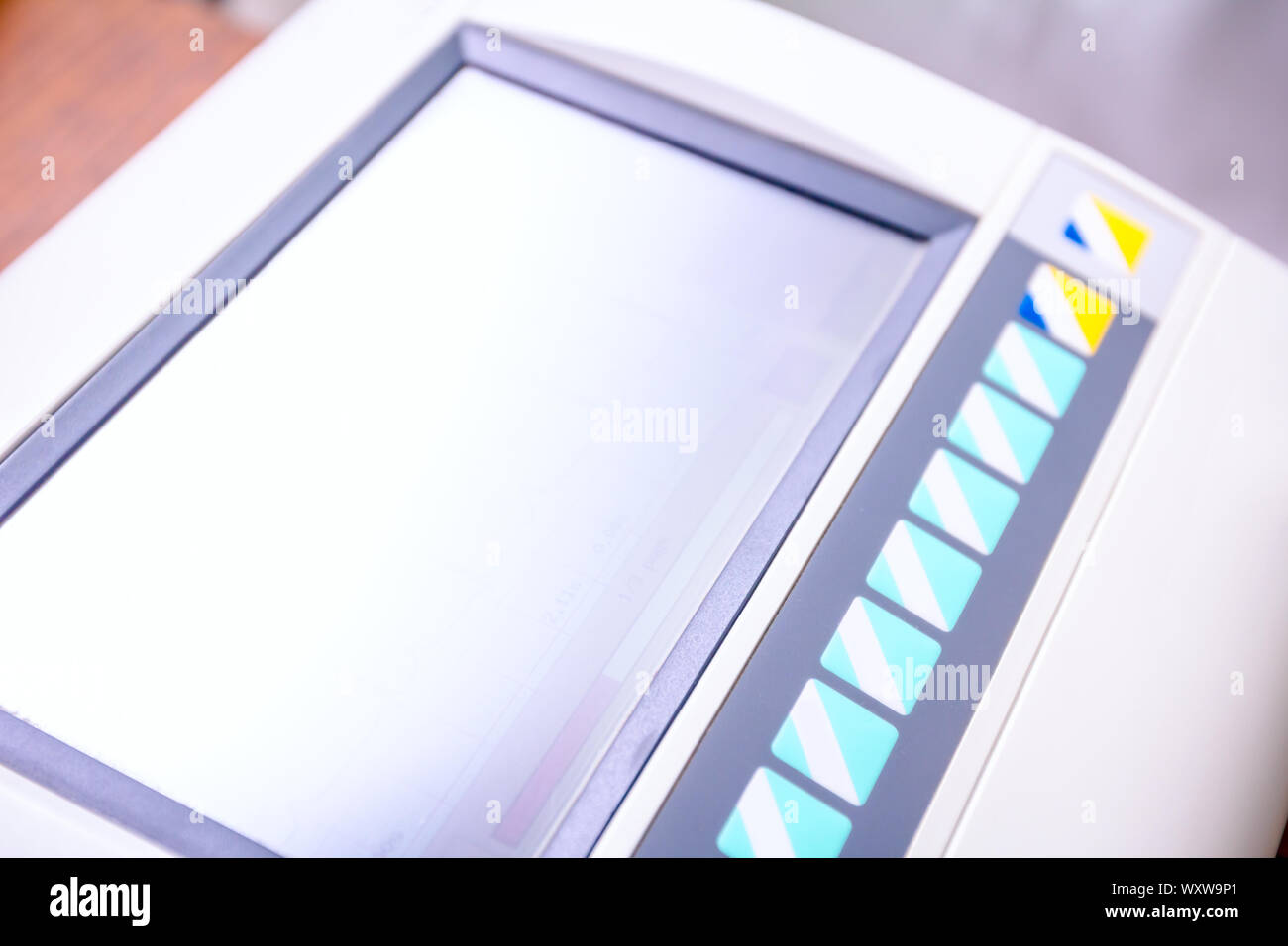 Modern machine with display for recording ECG or EKG over electrodes ...