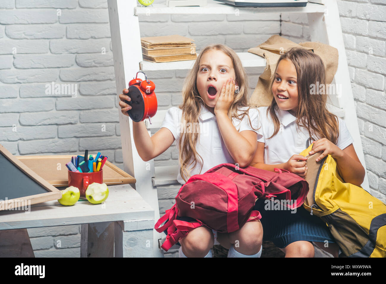 time management concept. time management of kids holding alarm clock ...