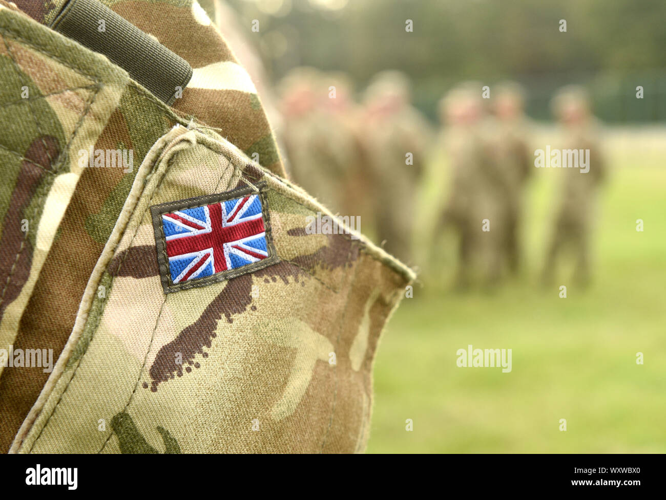 UK flag on soldiers arm. UK military uniform. United Kingdom troops ...